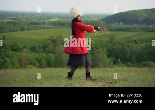 Georgian girl in white papakha and red national dress dances national ...