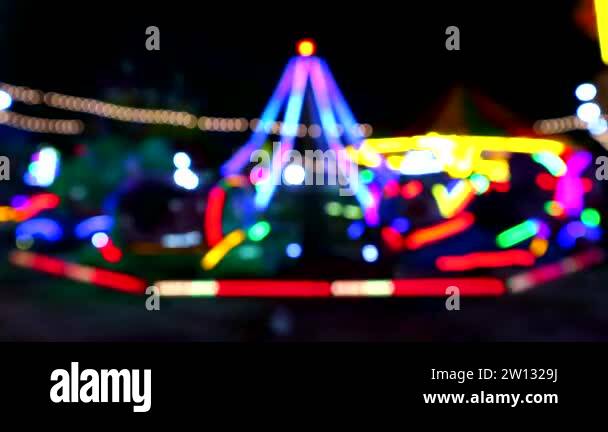 blur Carousel rolling neon light in the night market fair Stock Video ...