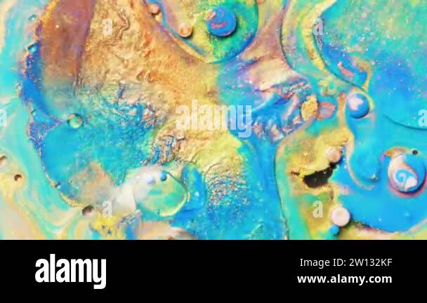 Colorful sparkling paints mix in beautiful patterns. Oil ink of yellow ...