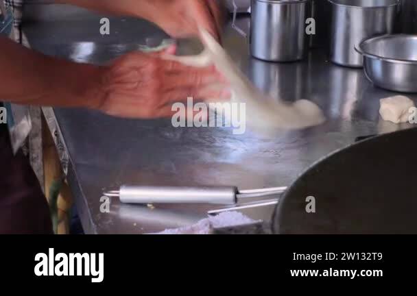 Roti Making, roti thresh flour by roti maker with oil. Indian ...