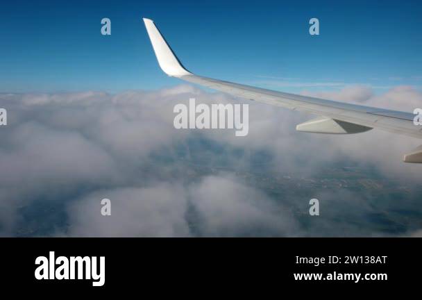 Airplane flight. View through the window of an airplane of the wing and ...