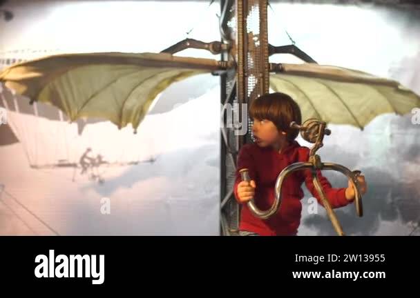the boy moves the wings of the aircraft mechanically Stock Video ...