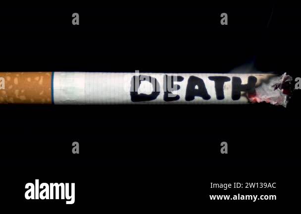 A cigarette smolders with the word "Death". Cigarette on a black ...