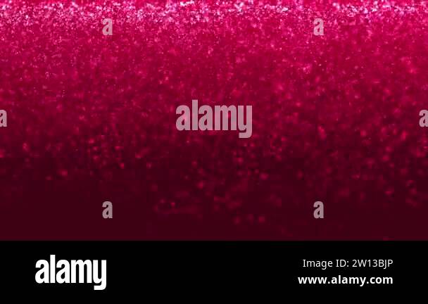 Gentle shimmering particles fast falling on red background. 4K UHD ...