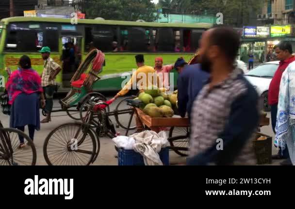 Unidentified people and street traffic at the Ring Road in the Adabor ...
