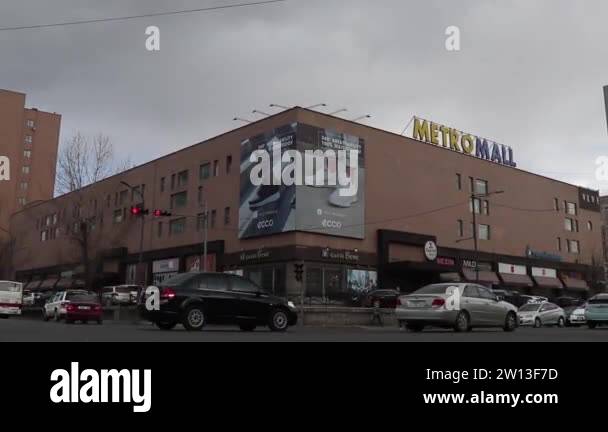 Street traffic at the Metro Mall, a department store in Ulaanbaatar, the capital of Mongolia ...