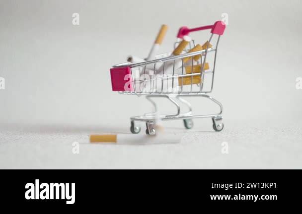 Cigarettes in shopping cart. Cigarettes in supermarket trolleys ...
