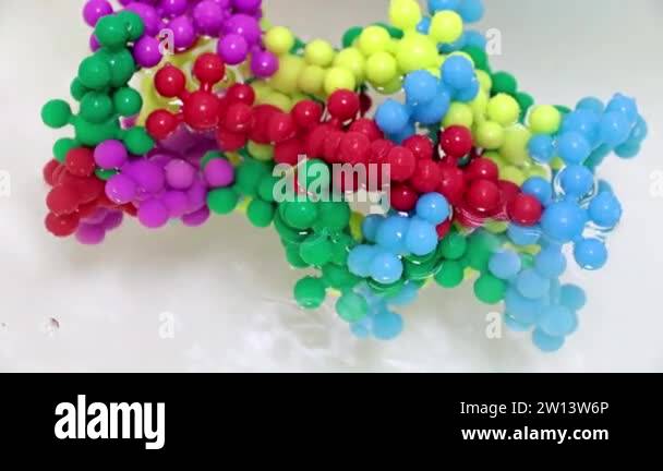 plastic model of a malignant painful virus in a stream of clean water ...