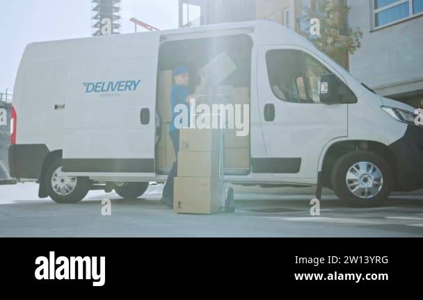Courier Opens Delivery Van Side Door and Takes out Cardboard Box ...