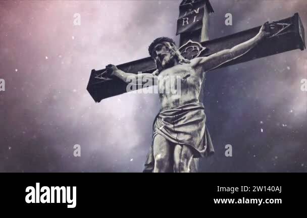Crucifixion cross with Jesus Christ statue over stormy clouds and Snow falling Stock Video ...