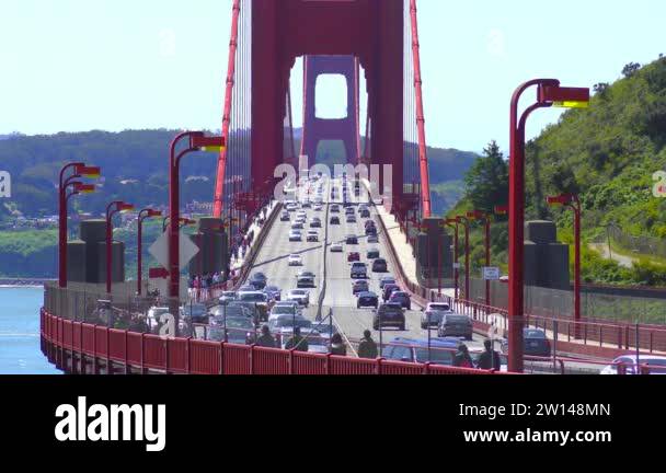 Traffic on the suspension bridge spanning the Golden Gate, the one-mile ...