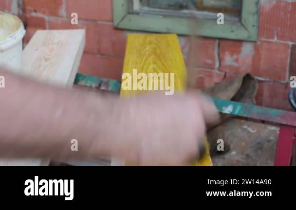 Preparation of boards for construction, men's hands work with wooden ...