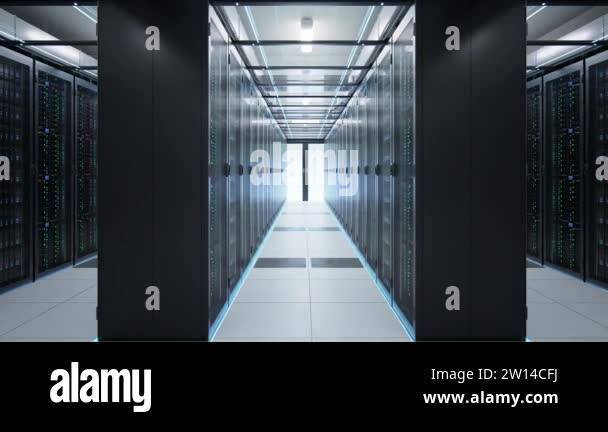 Camera moving in data center in dim light showing racks of server ...