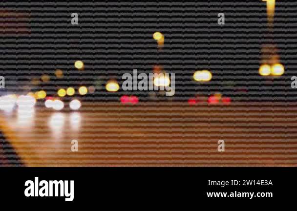 Animation of busy road traffic on a city street at night in fast motion ...