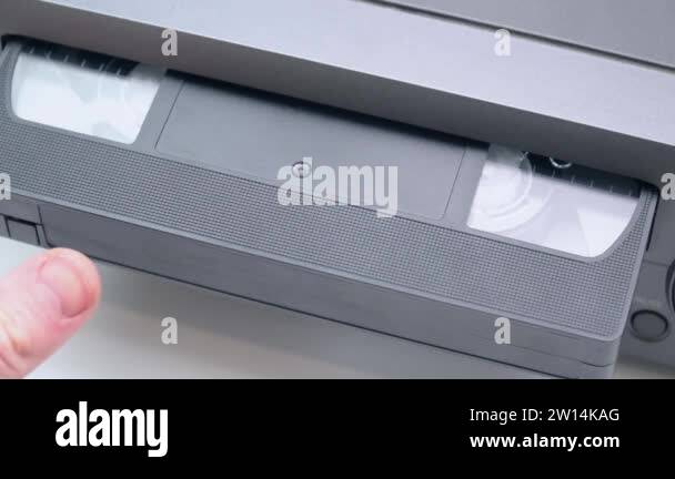Close-up a VHS video cassette recorder tape loading. VHS mechanics ...
