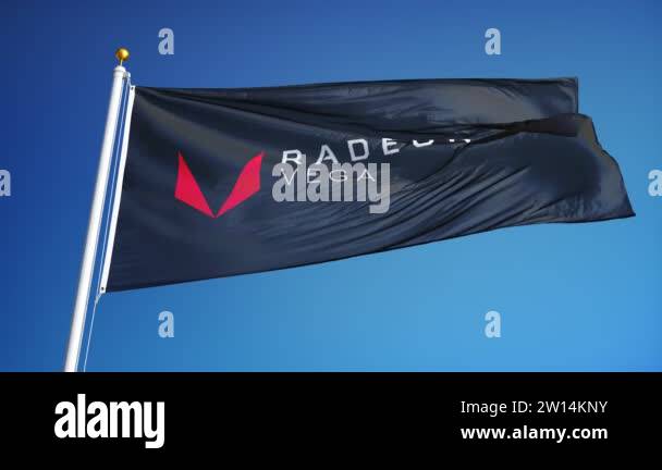 AMD Radeon Vega brand flag waving in slow motion against blue sky ...