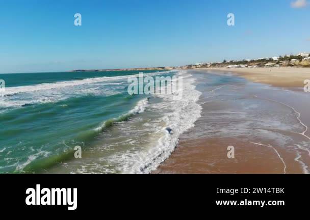 Huge sandy beach, beautiful Atlantic Ocean Coast with light sea waves ...