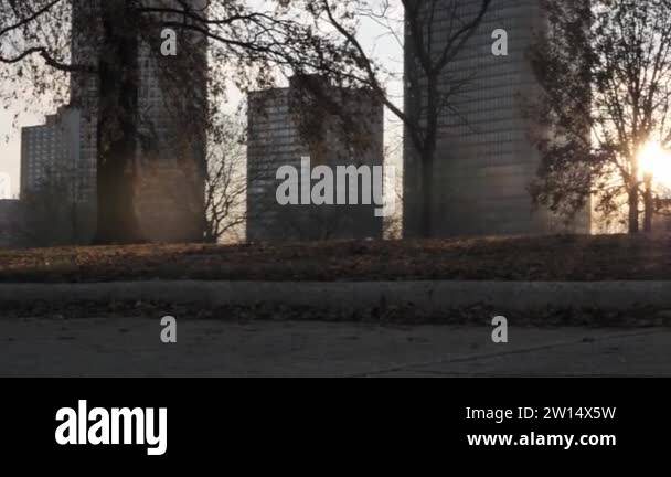 Horizontal panning shot from a low vantage point perspective of a city ...
