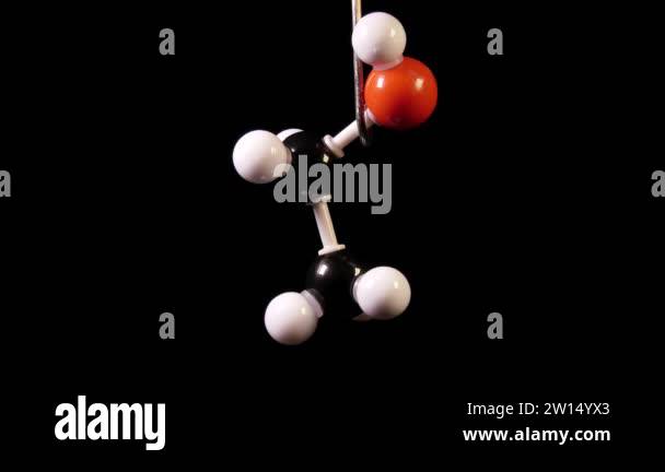 Chemical Formula of a molecule rotating isolated on a black background ...