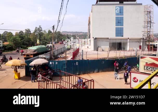 Unidentified people and street traffic at the centre of Kicukiro ...