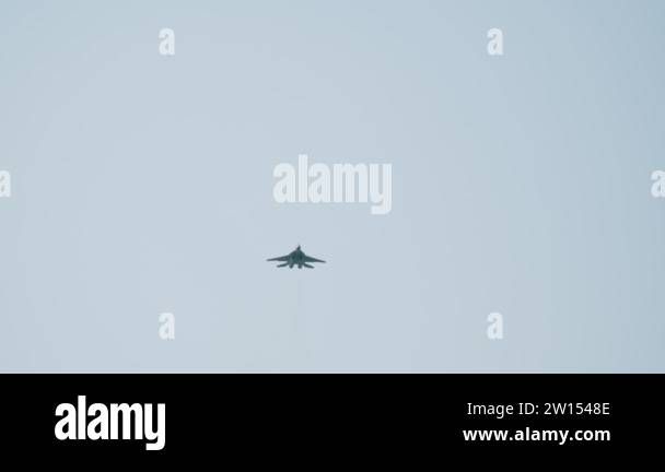 30 AUGUST 2019 MOSCOW, RUSSIA: A light blue reactive fighter jet flying ...