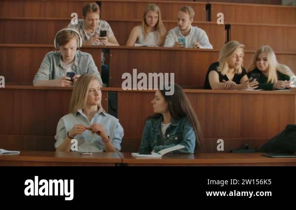 A large group of students during the break communicate with each other ...