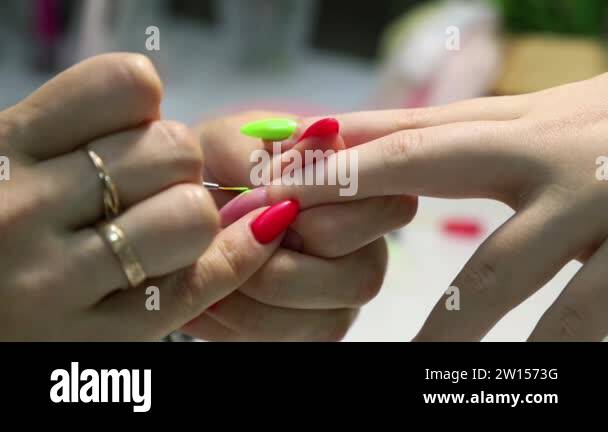 Professional manicure. Nail extension. Applying an artistic drawing to ...