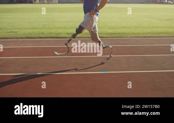 Athletic Disabled Fit Man with Prosthetic Running Blades is Training on ...