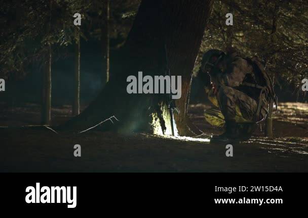 Night Scene Of Male Soldier Wearing Full Uniform And Gear Crouching And ...