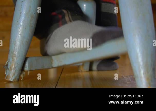 The operation of the foot drive mechanism of the old spinning wheel ...