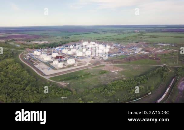 Top view of industrial tanks. Clip. Industrial refinery with onshore ...