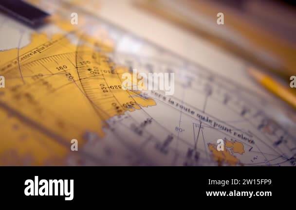 Plotting position on navigational chart at sea. Marine Map and ruler ...