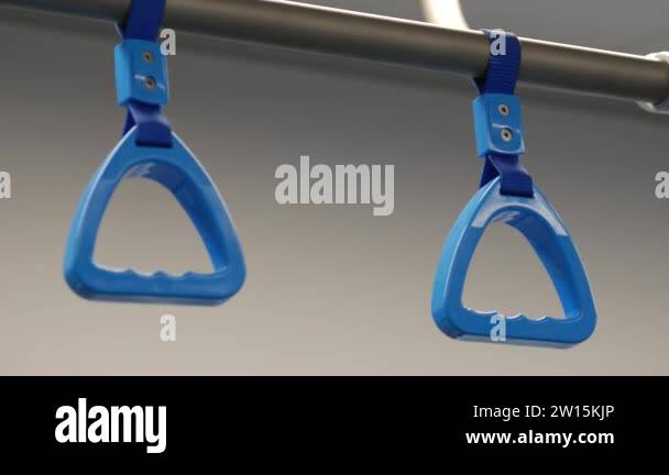 Plastic blue handle grip hang on nylon belts in the cars of the Moscow Central Ring. Handles ...