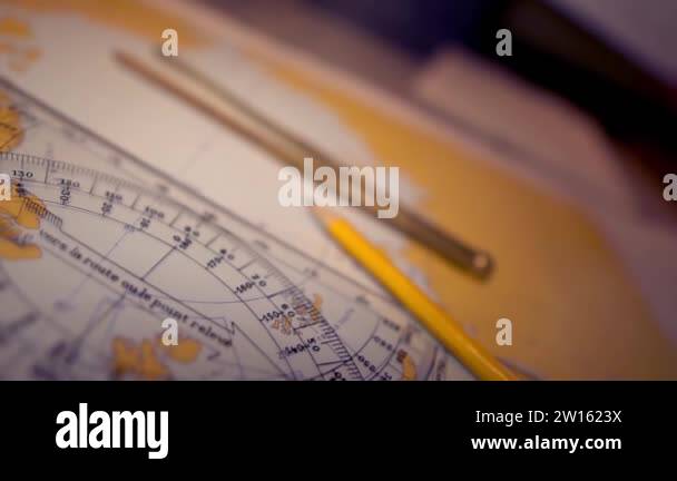 Plotting position on navigational chart at sea. Marine Map and ruler ...