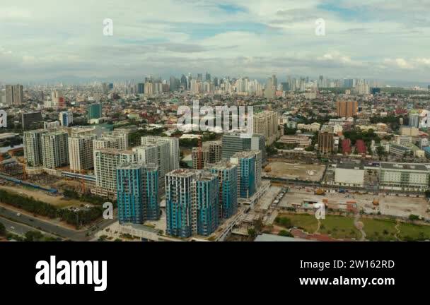 Construction of high modern houses in Manila. The city of Manila, the ...