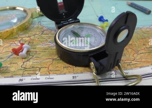 A magnetic compass, where it is used as a navigation tool, and a map ...