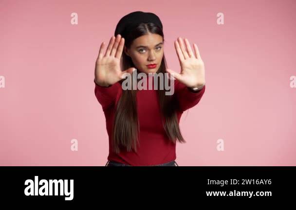 Angry annoyed woman raising hands up to say no stop. distrustful look ...