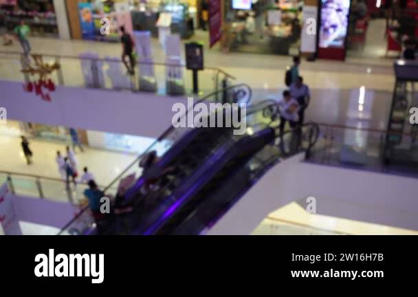 abstract blur background of shopping mall and crowd of walking people ...