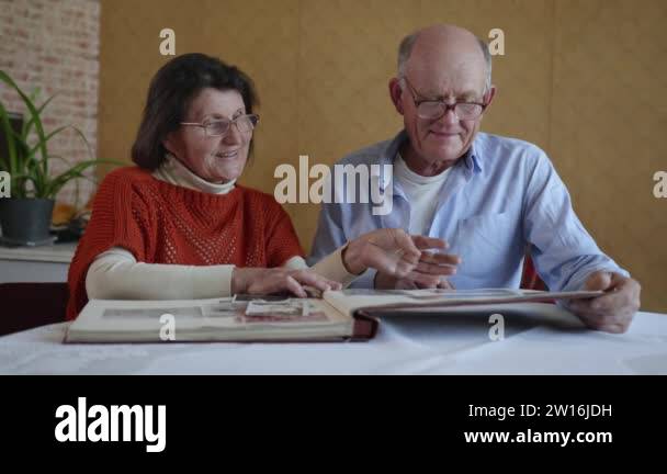 pleasant memories, an elderly happy married couple share a memory ...