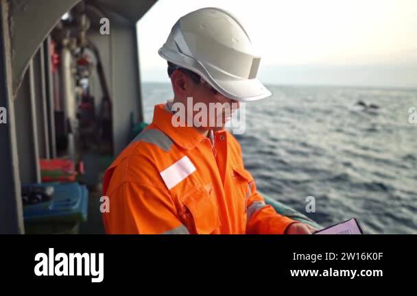 Filipino deck Officer on deck of offshore vessel or ship fills ...