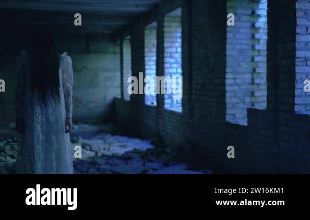 Scary ghost of dead bride standing in windy deserted building, horror ...