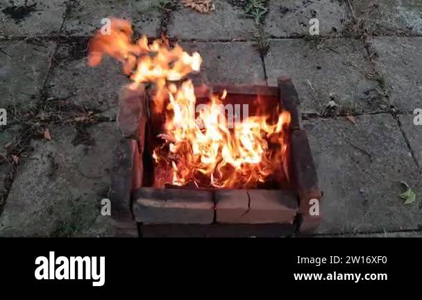 Campfire in fireplace. Wood bonfire with bright red flame in old ...