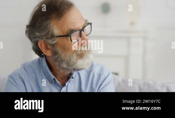 Close up of Caucasian old wise handsome man looking at side and ...
