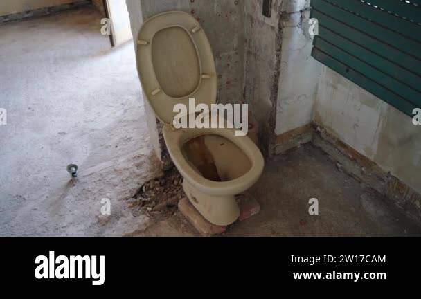 Sanitary and hygiene concept, old dirty rusty toilet in abandoned ...