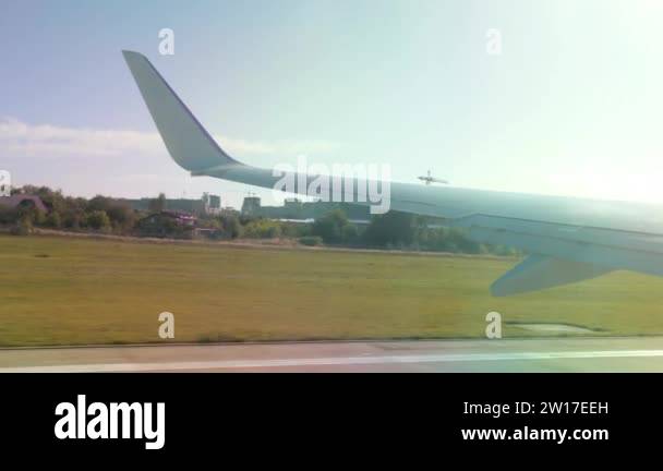 Airplane flight. View through the window of an airplane of the wing and ...