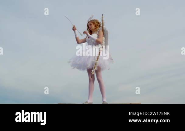 Cupid cute girl with a bow. Cherub girl. arrow and wings. Little girl with angel wings and halo ...