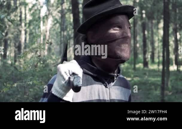 Serial maniac with axe in forest. Bloody killer, murderer, mad man in ...