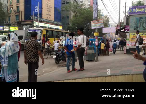 Unidentified people and street traffic at the Ring Road in the Adabor ...