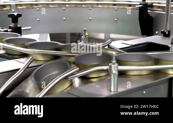 Empty cans in the production process pass through the production line ...