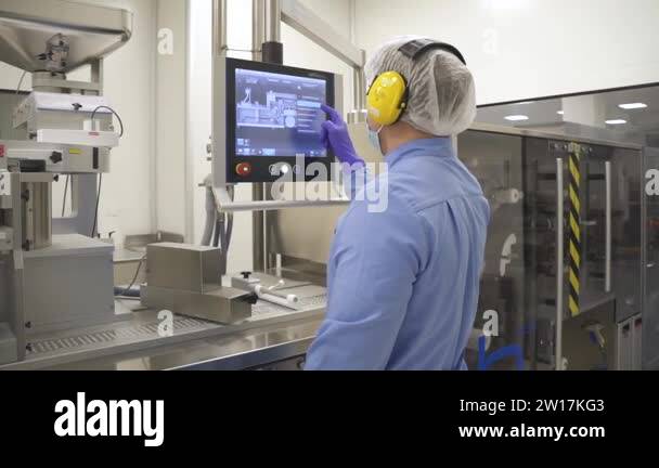 Pharmacist control pharmaceutical manufacturing process at drug factory ...